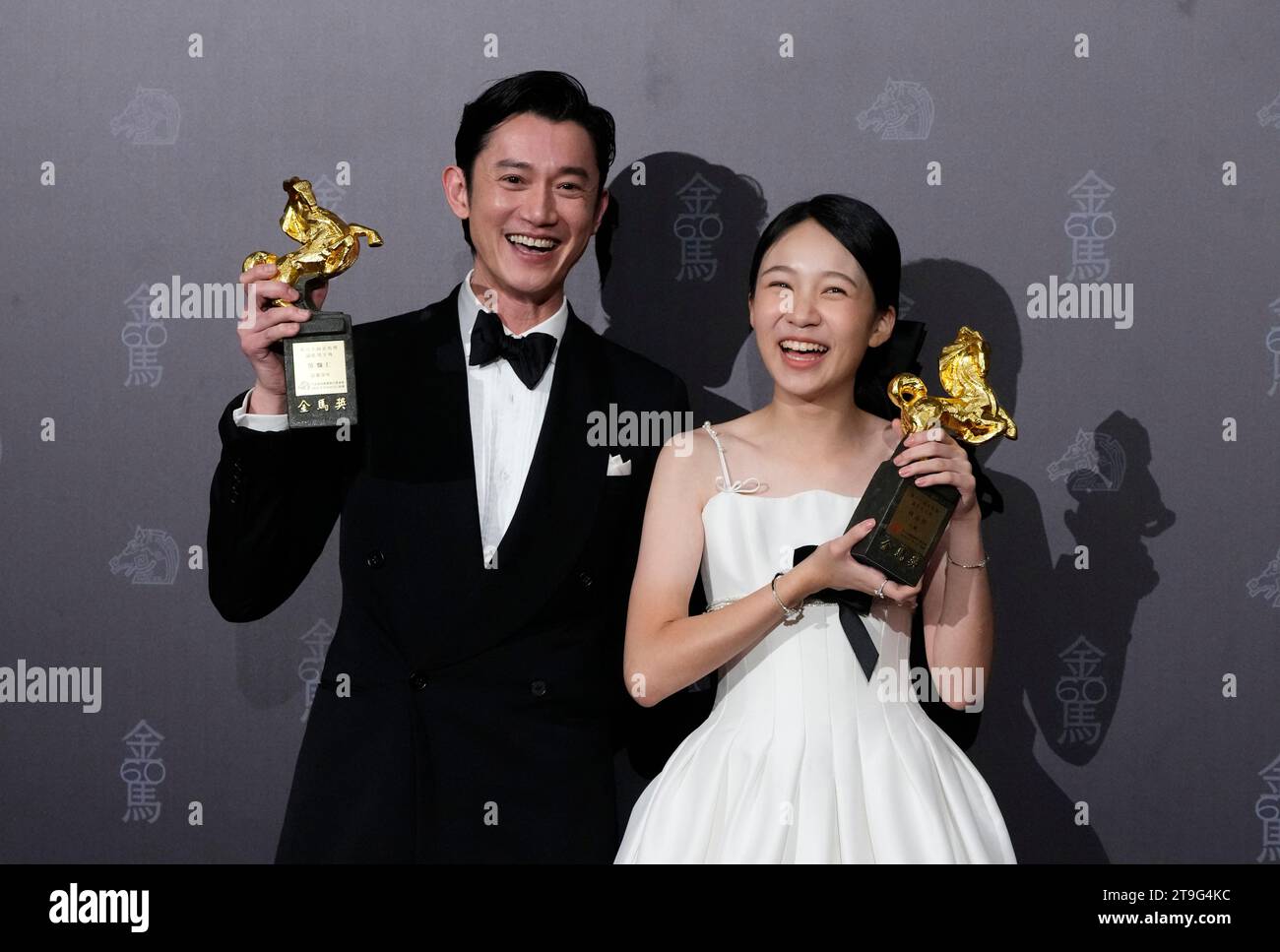 Taiwanese actress Audrey Lin, right, and Taiwanese actor Wu Kang-ren hold their awards for Best ...