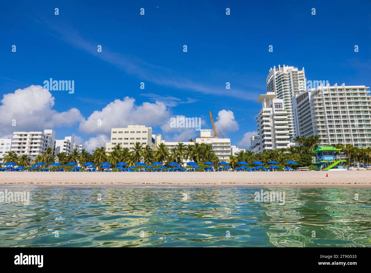 Beautiful sight of Atlantic Ocean's sandy beach featuring sun loungers ...