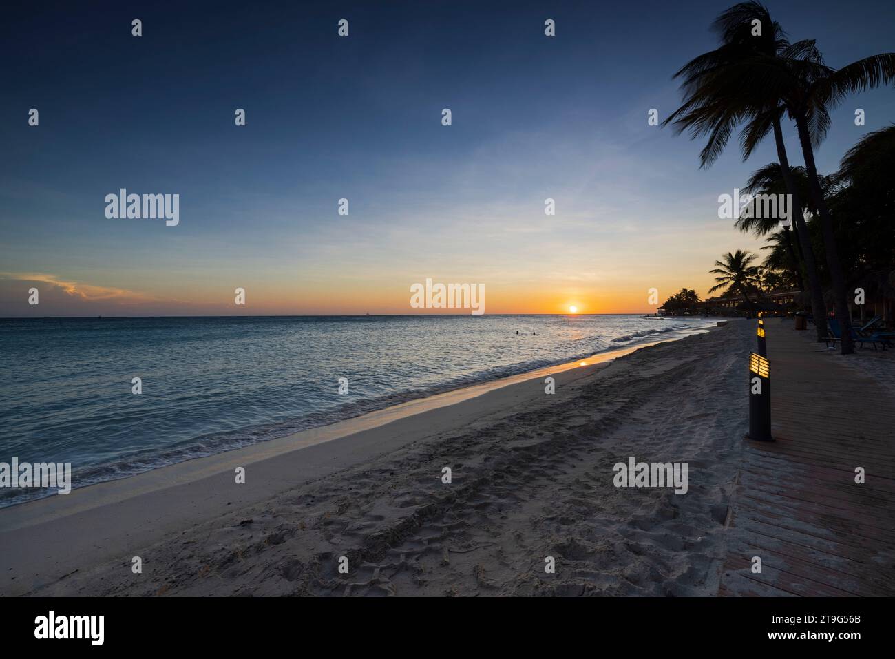 Breathtaking view of sunset in Caribbean sea casting gorgeous glow over ...