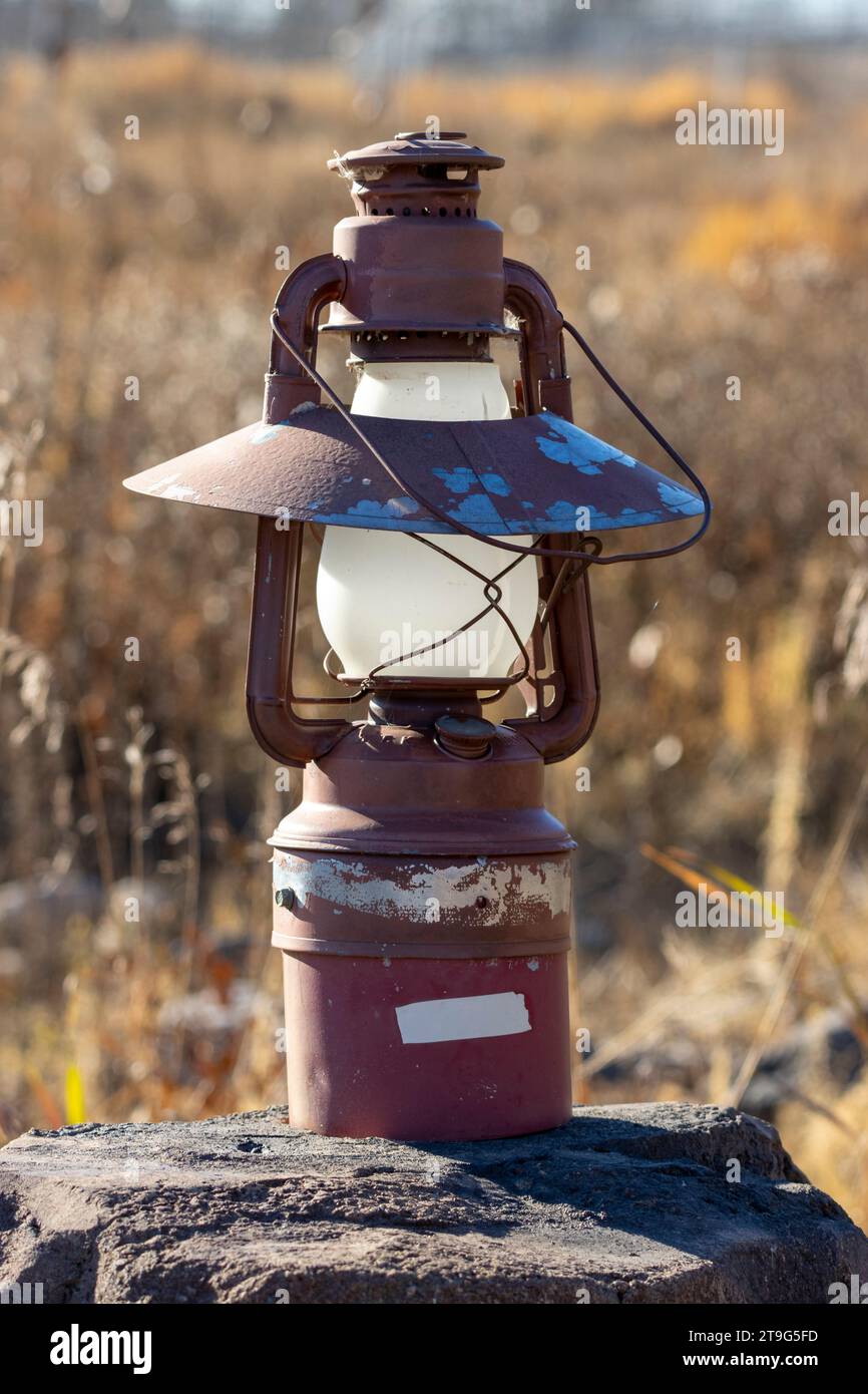 oil lamp sitting in grass Stock Photo - Alamy