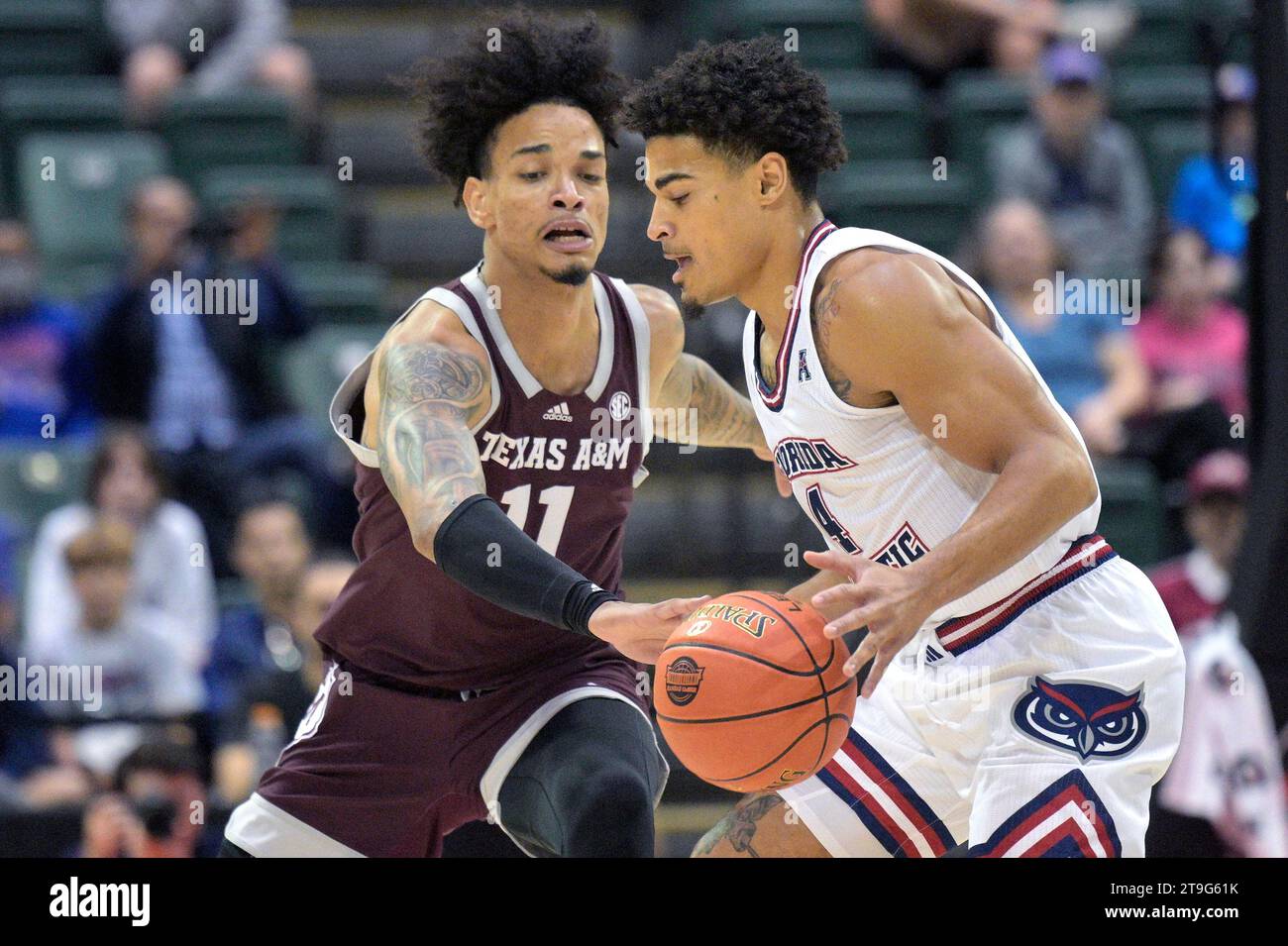 Florida Atlantic guard Bryan Greenlee (4) is defended by Texas A&M ...