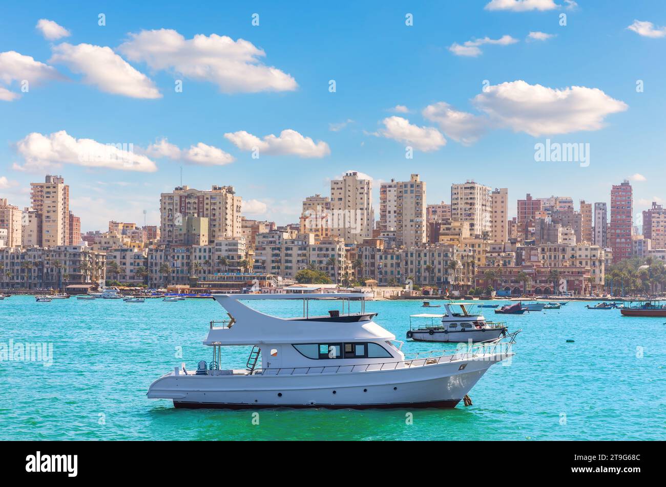 Boats in the harbour is the populated city district of Alexandria by ...