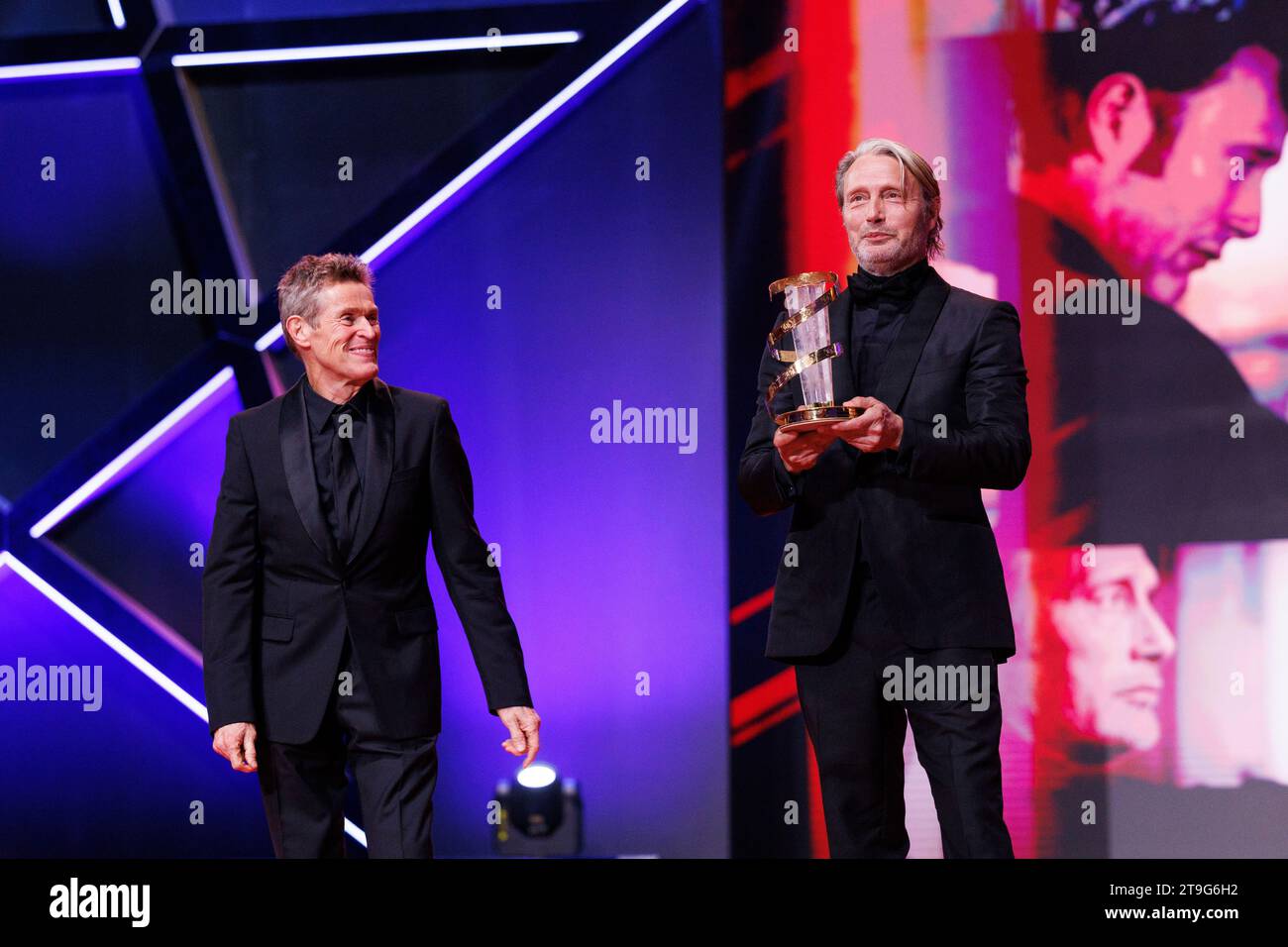 Mads Mikkelsen receives the tribute award from Willem Dafoe during the ...