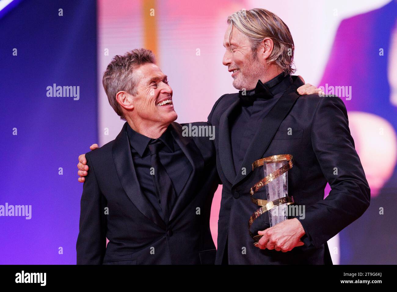 Mads Mikkelsen receives the tribute award from Willem Dafoe during the ...