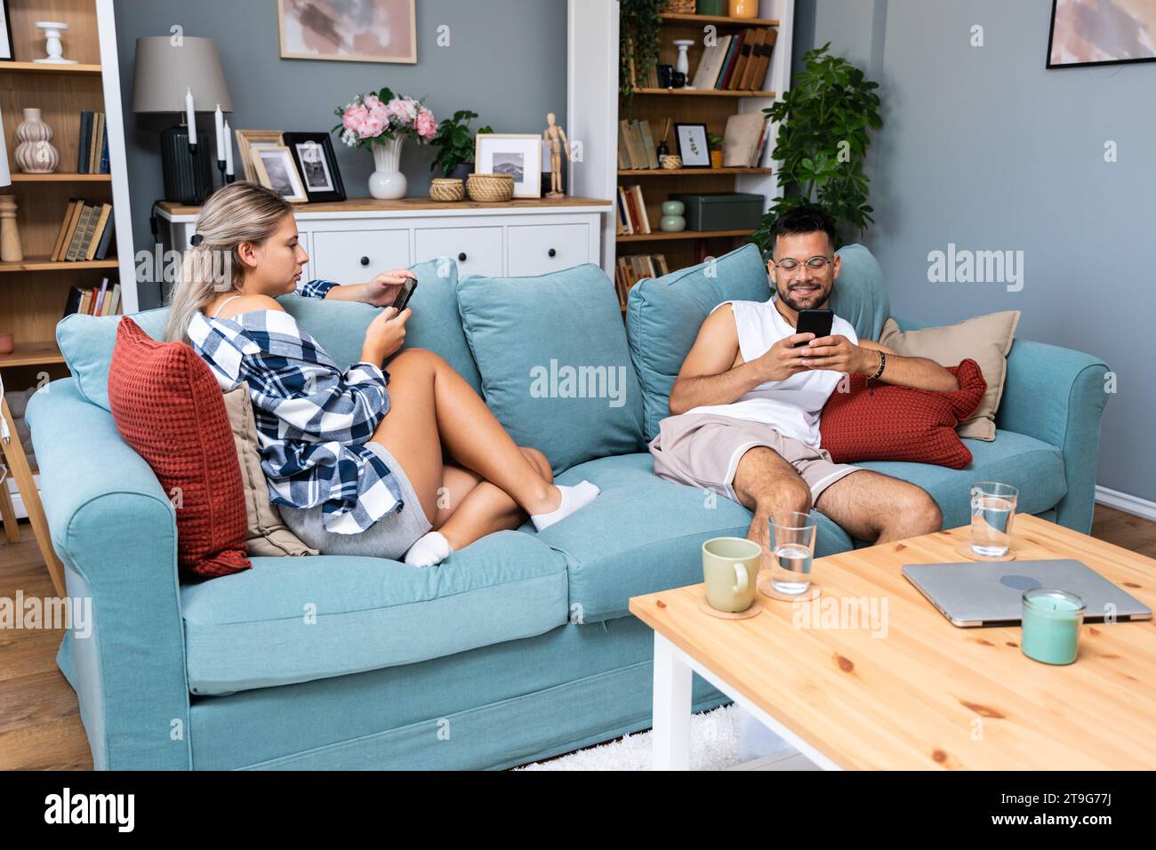 Young couple addicted to social network media scrolling their ...