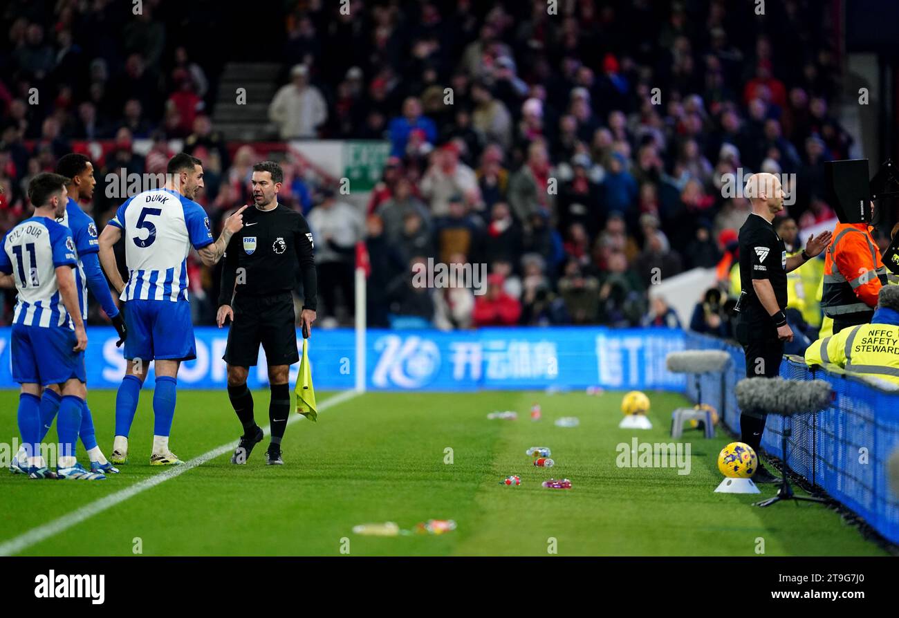 Referee Anthony Taylor reviews a decision on the VAR monitor, and ...