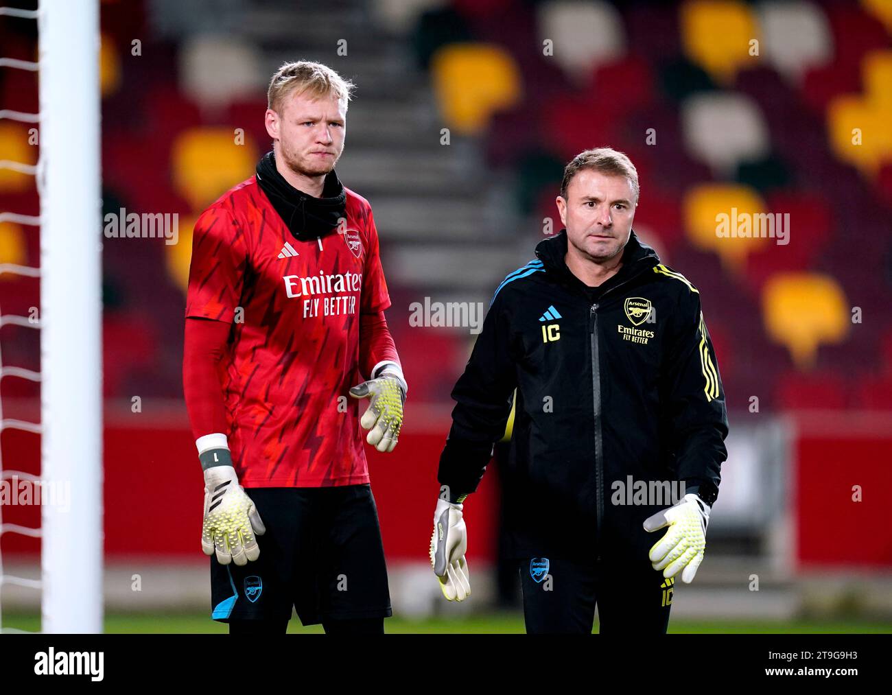 Arsenal goalkeeper Aaron Ramsdale (left) warms up with goalkeeping ...