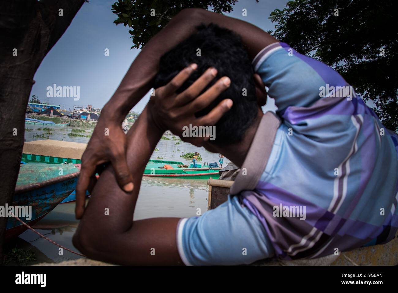 Traditional cargo boat station beside the riverbank. A picturesque ...