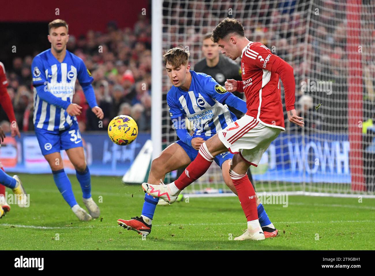 Neco Williams of Nottingham Forest crosses the ball under pressure from ...