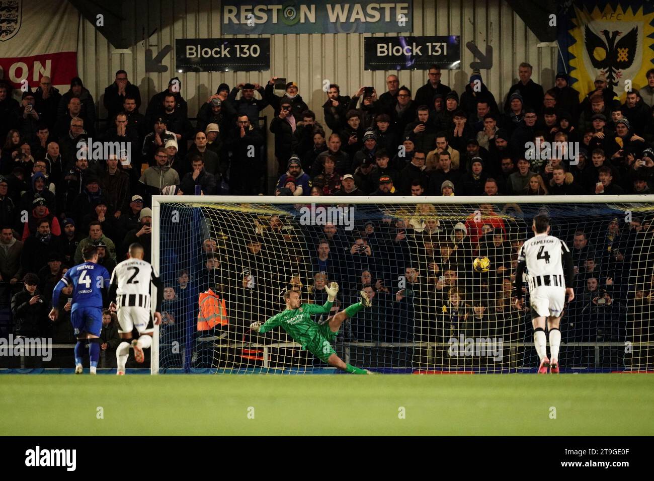 AFC Wimbledon's Jake Reeves scores their side's third goal of the game ...