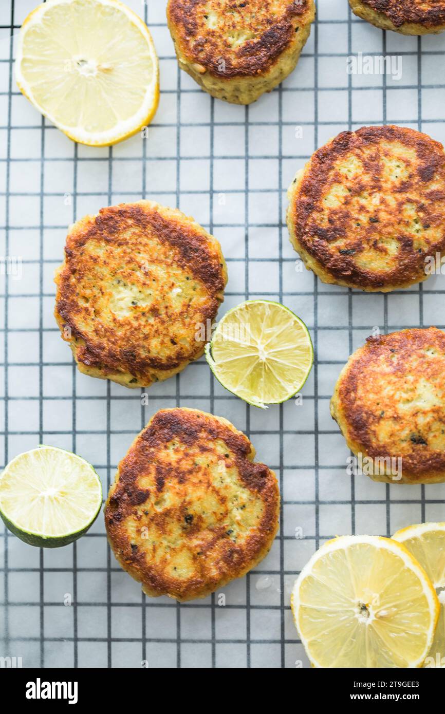 Traditional homemade fish cakes with tlemon and sour cream Stock Photo ...