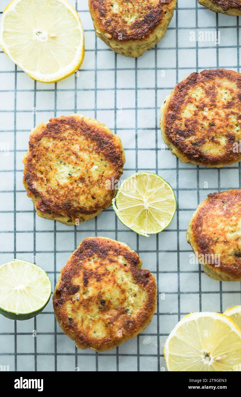 Traditional homemade fish cakes with tlemon and sour cream Stock Photo ...