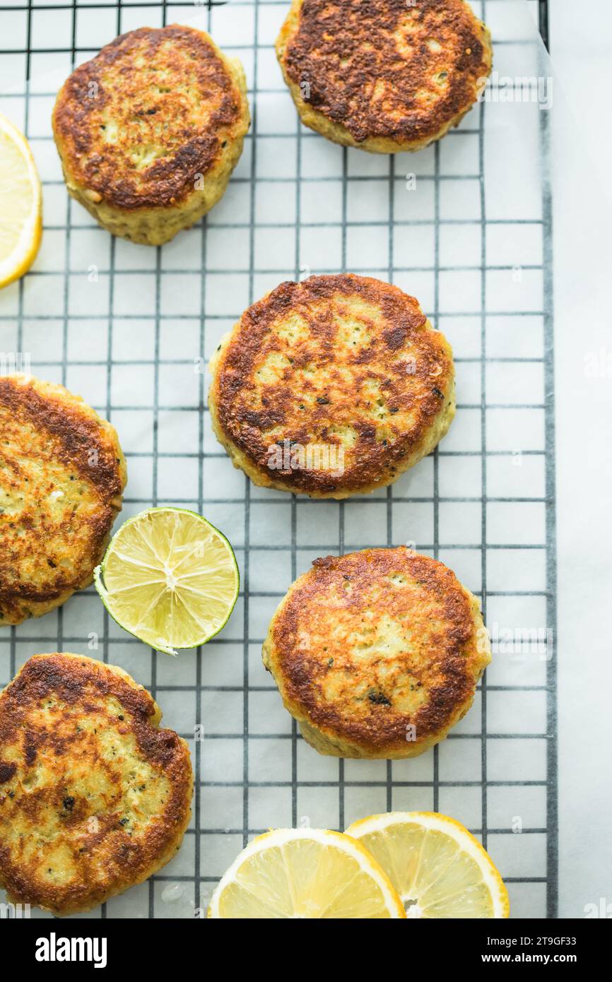 Traditional homemade fish cakes with tlemon and sour cream Stock Photo ...