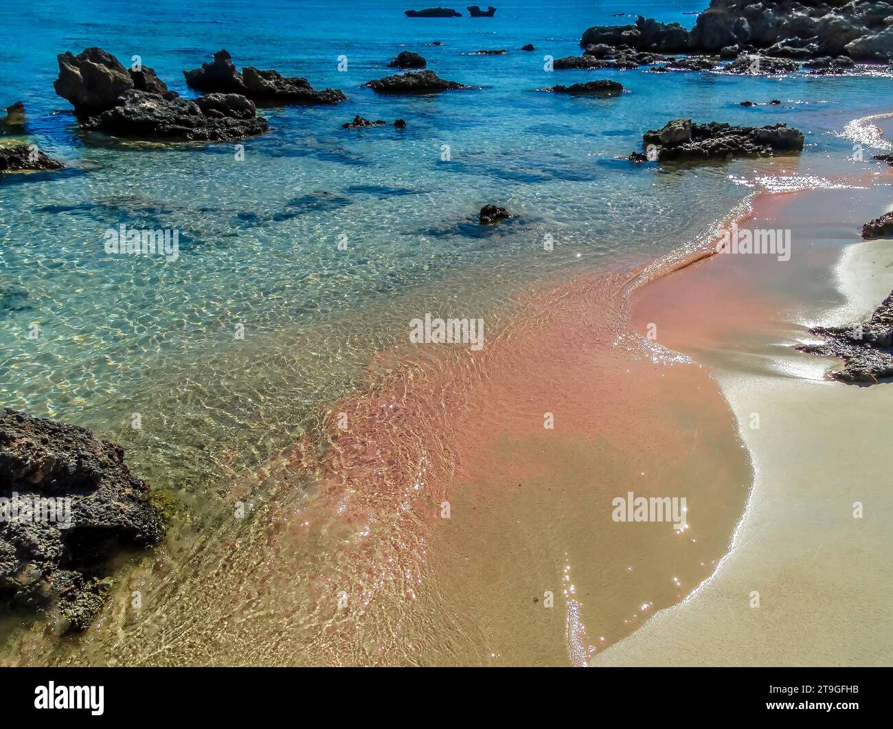 The famous pink sand at the shoreline on the island at Elafonissi beach ...
