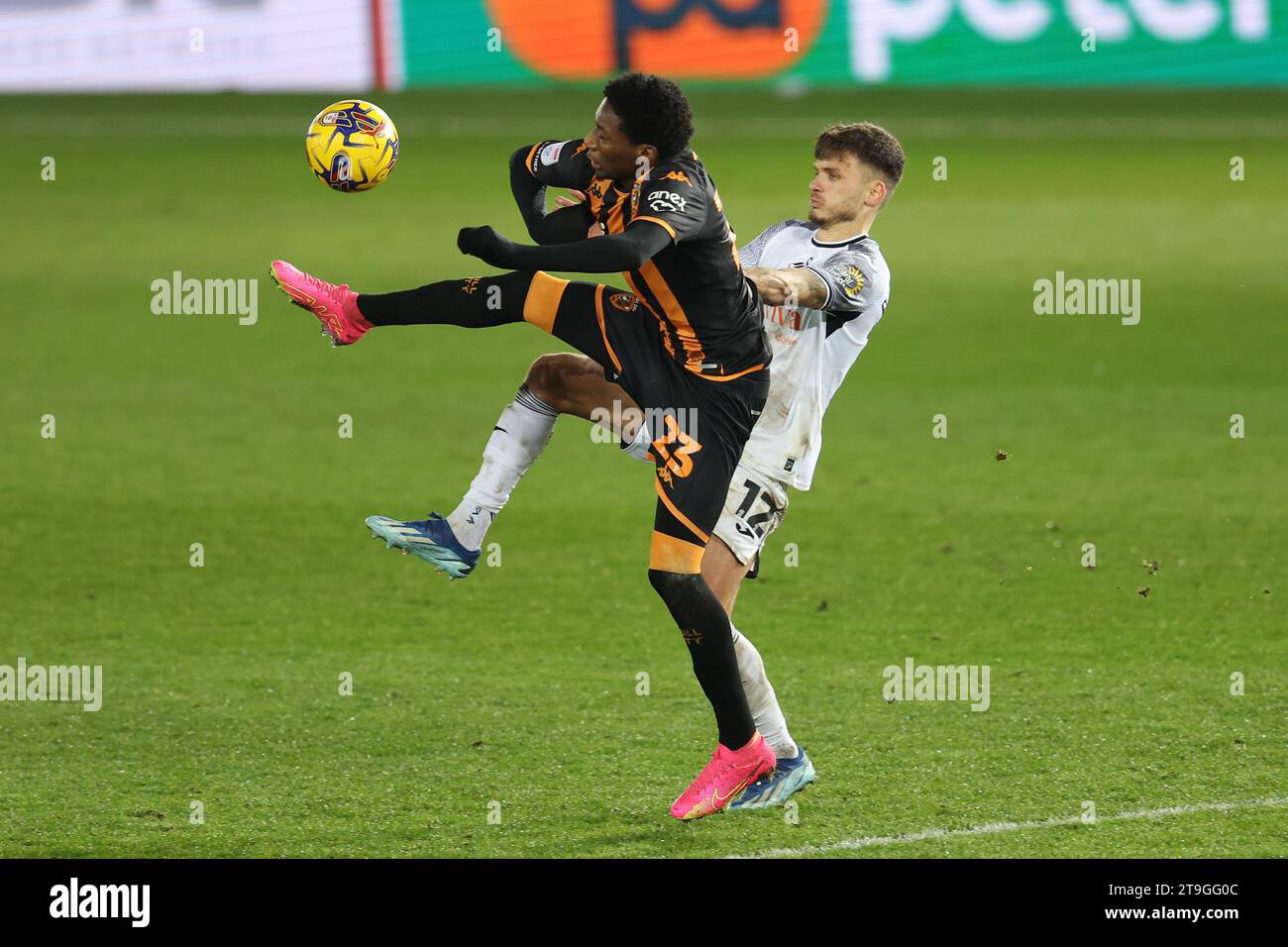 Swansea, UK. 25th Nov, 2023. Jaden Philogene of Hull city (l) & Jamie ...