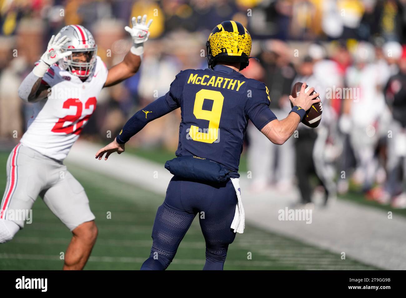 Michigan quarterback J.J. McCarthy (9)kk is pressured by Ohio State ...
