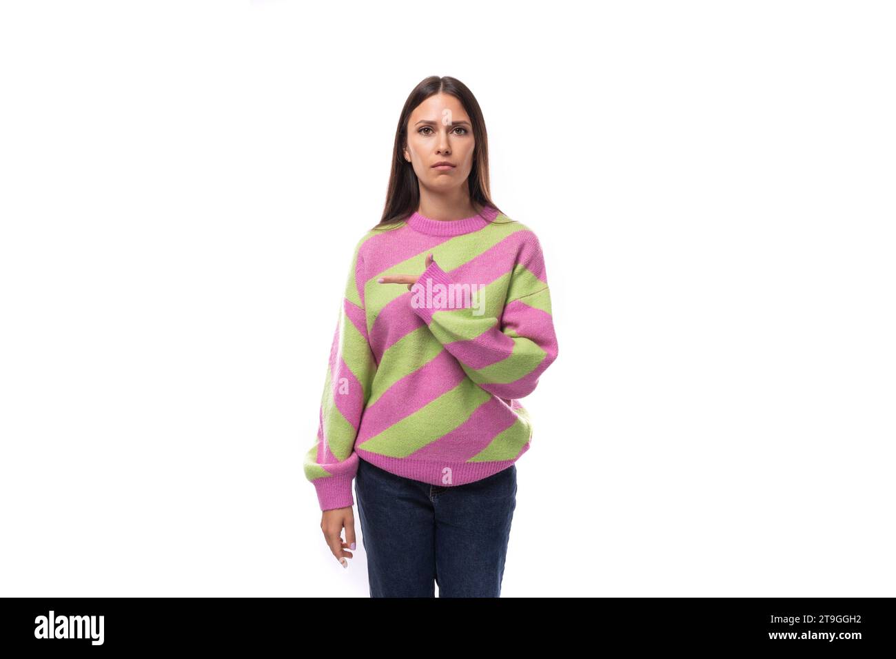 well-groomed slim young european brunette woman dressed in a striped ...