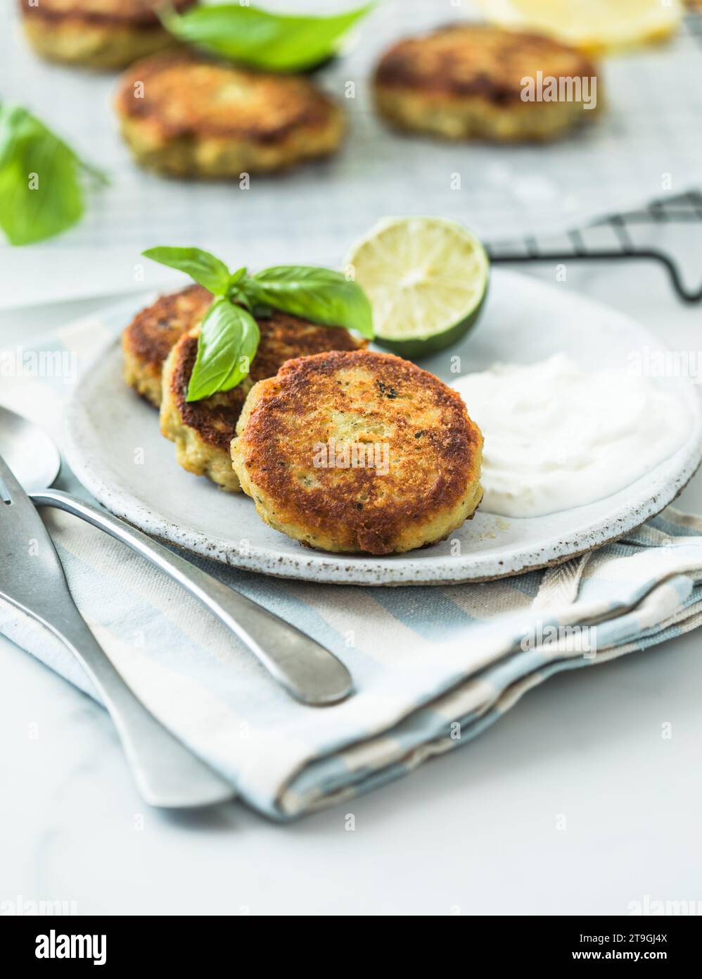 Traditional homemade fish cakes with tlemon and sour cream Stock Photo ...