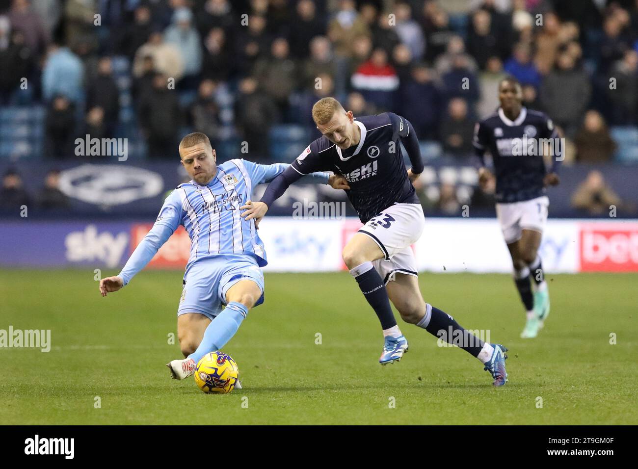 London, UK. 25th Nov, 2023. Jake Bidwell of Coventry City and George ...