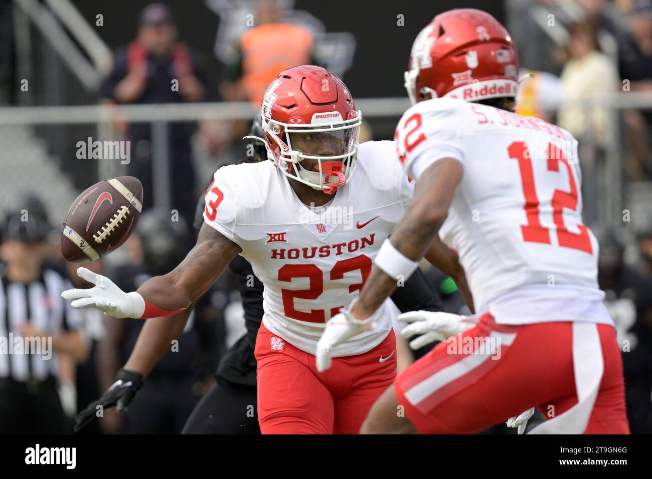 Houston running back Parker Jenkins (23) flips the ball to wide ...