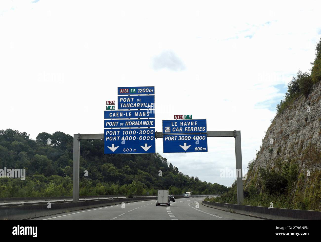 large road sign with French locations to reach the port of LE Havre or ...