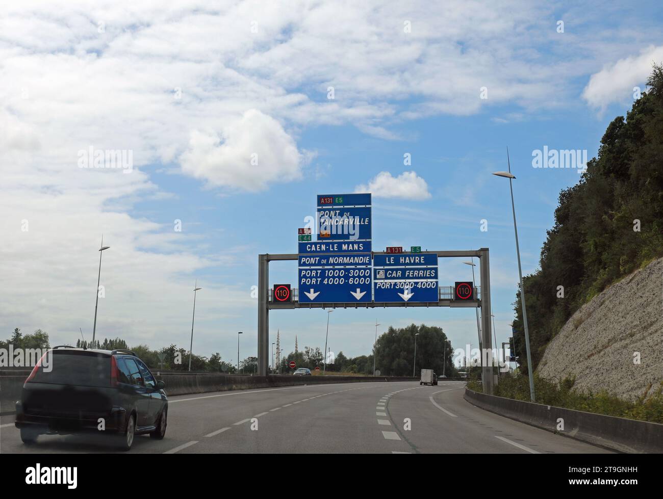 large road sign with French locations to reach port Le Havre Port or ...