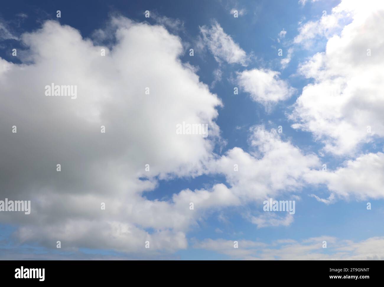 blue sky with clouds and a sun in the corner ideal as a background for ...