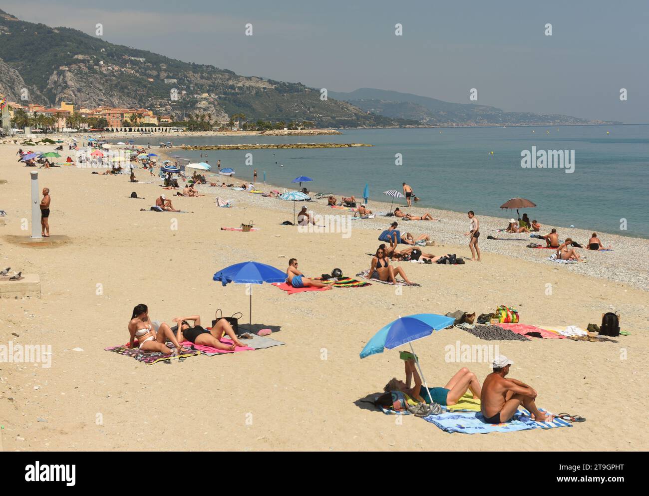 Menton, France - June 18, 2019: People rest on the beach of the Menton ...