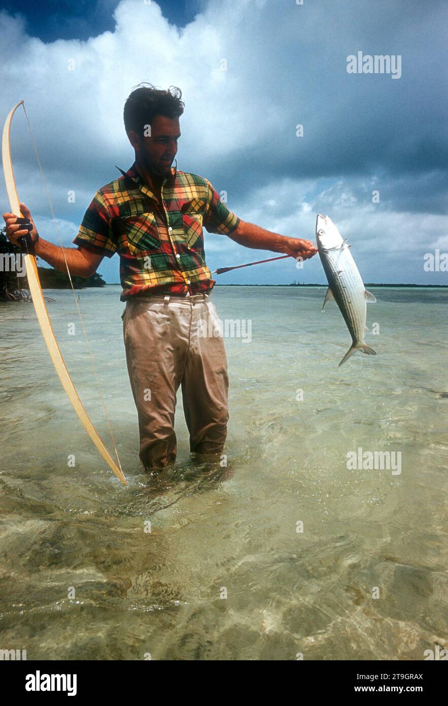 BAHAMAS - APRIL 7: Colyn Rees holds up the fish he shot with his bow ...