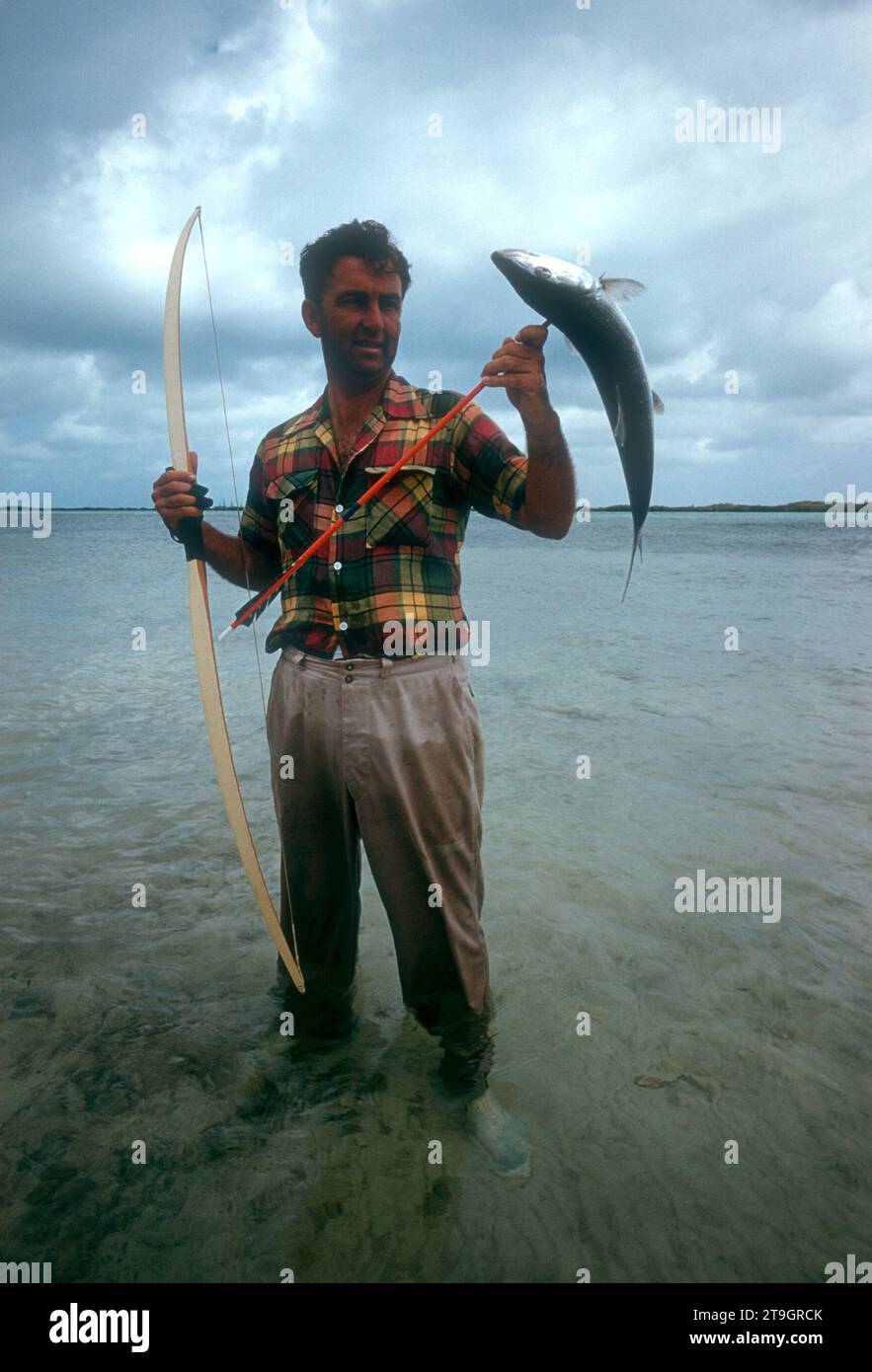 BAHAMAS - APRIL 7: Colyn Rees holds up the fish he shot with his bow ...