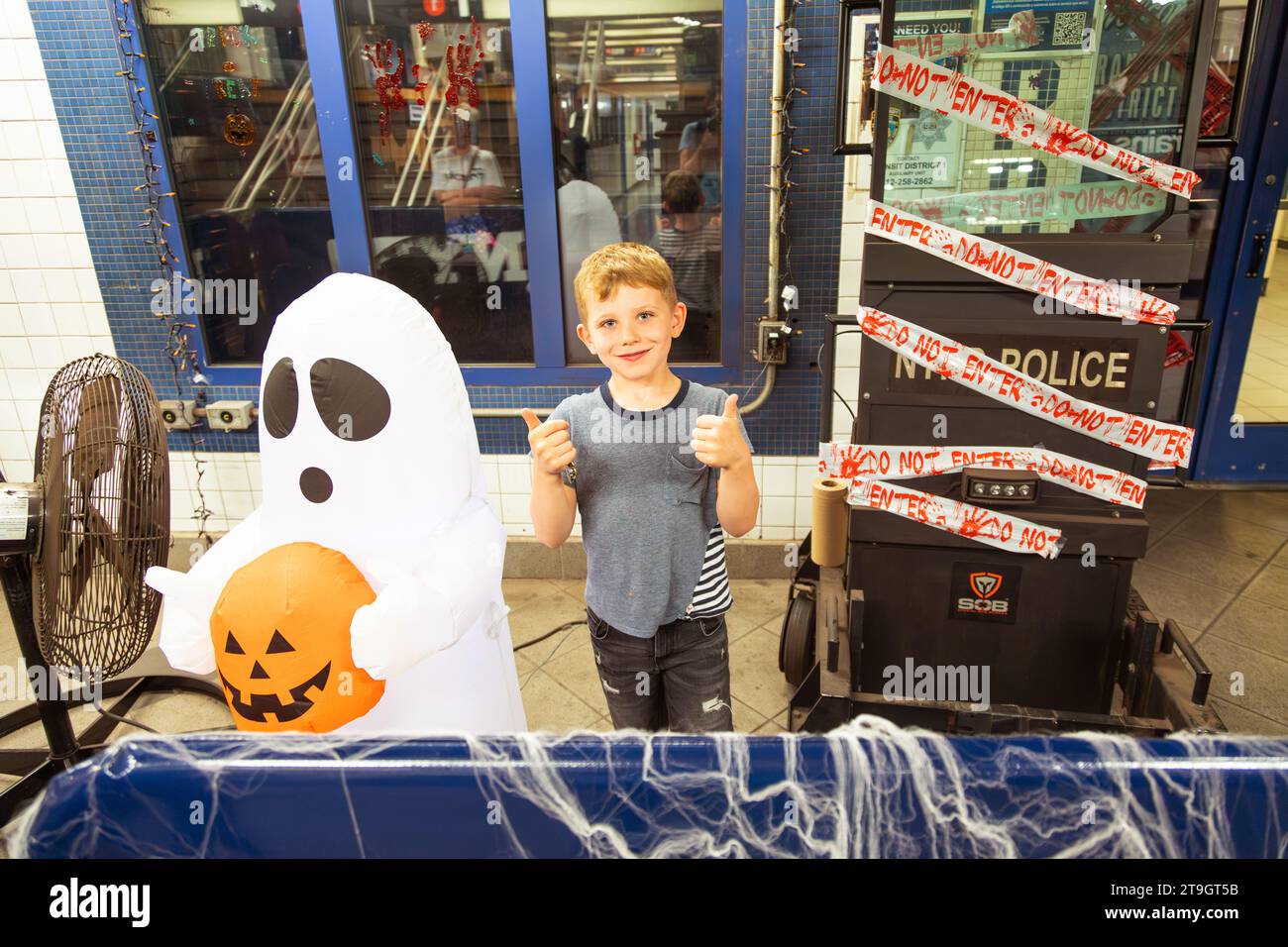 7 year old boy outside a police station covered in Halloween ...