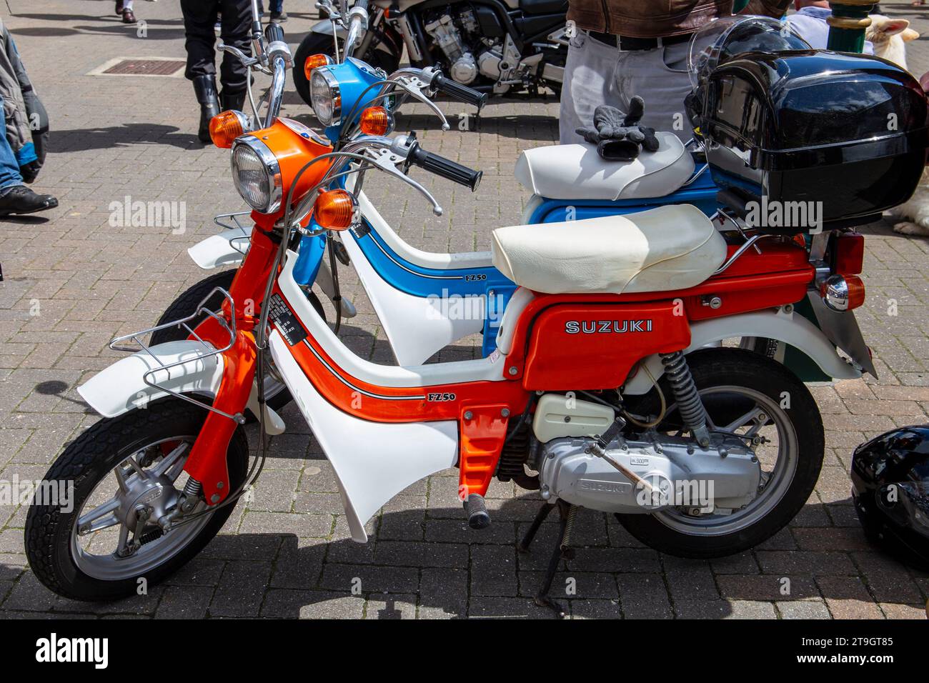Two Suzuki FZ50 mopeds at the Calne bike meet July 2023 Stock Photo - Alamy