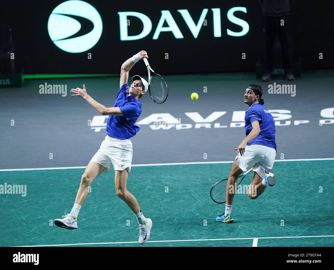 Italy's Jannik Sinner (left) and Lorenzo Sonego on their way to defeating Serbia's Novak ...