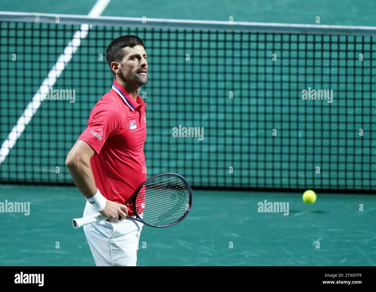 Serbia's Novak Djokovic stands dejected after losing in the doubles match to Italy's Jannik ...