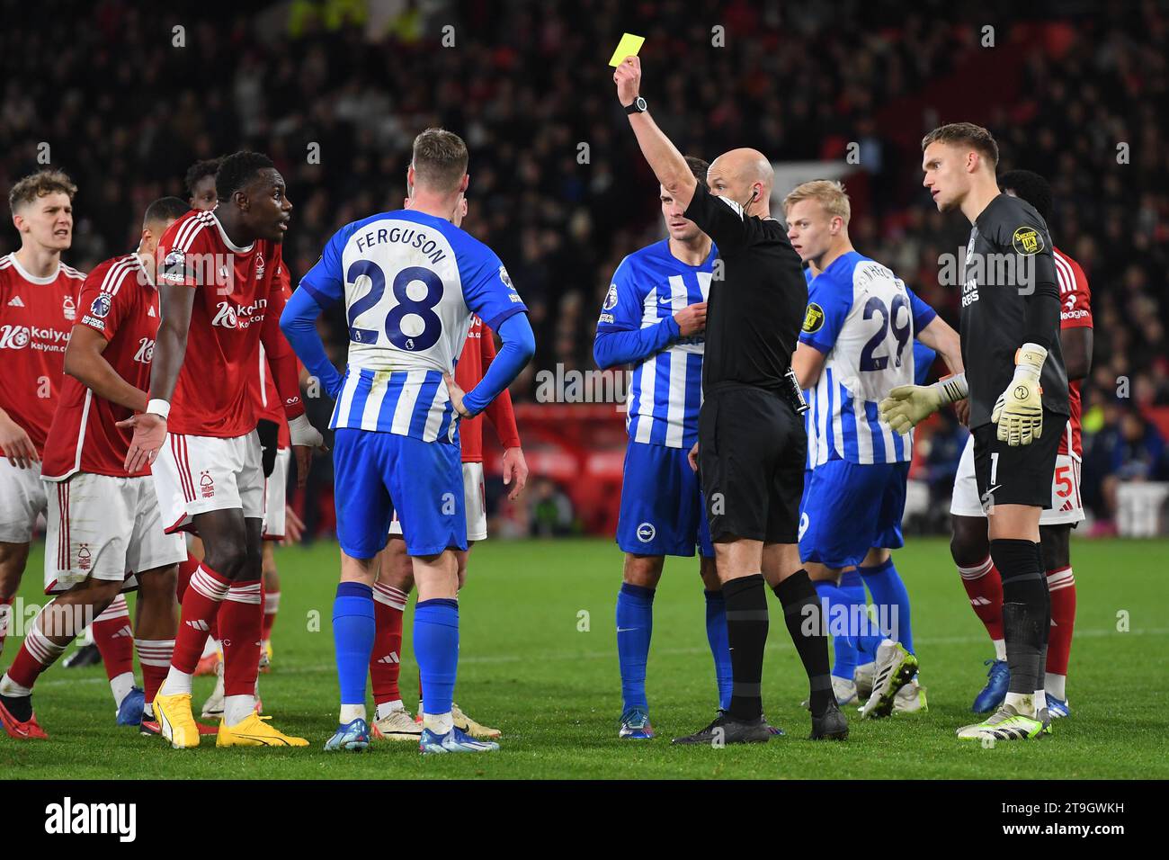 Referee, Anthony Taylor shows yellow cards to Moussa Niakhate of ...