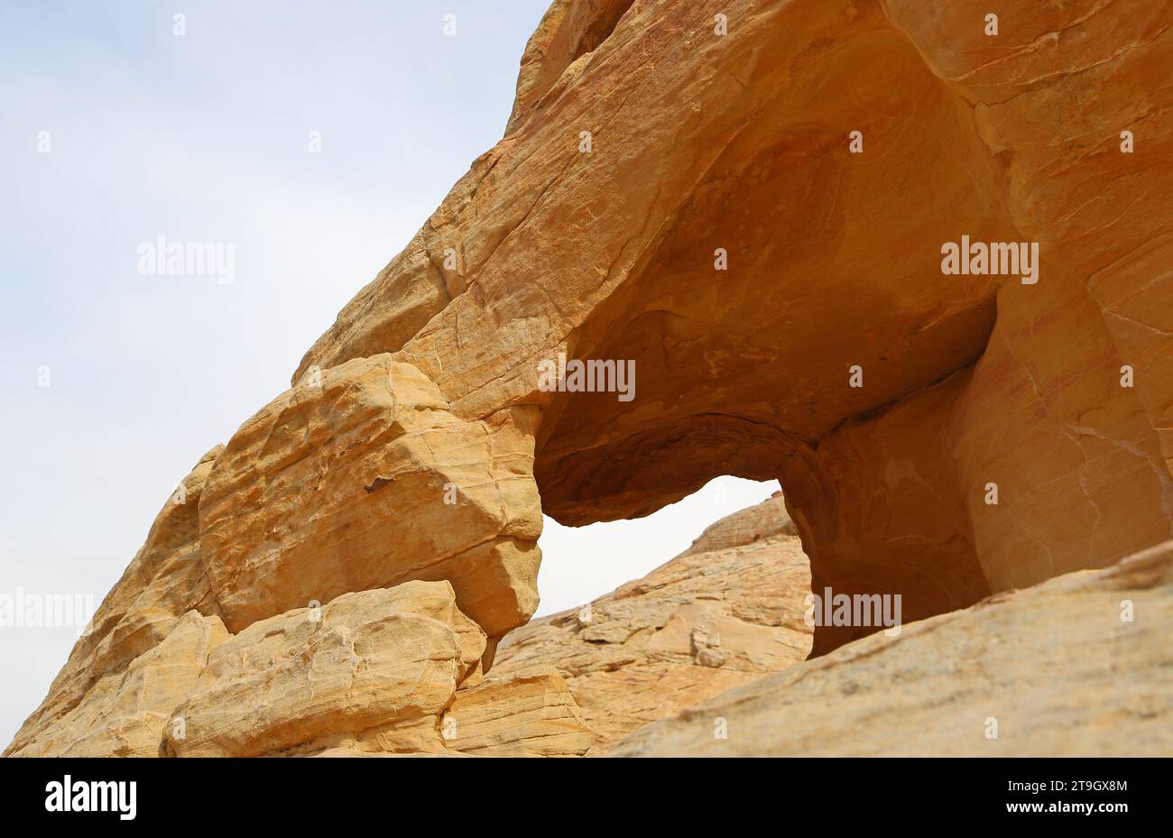 Natural window in yellow cliff - Valley of Fire State Park, Nevada ...