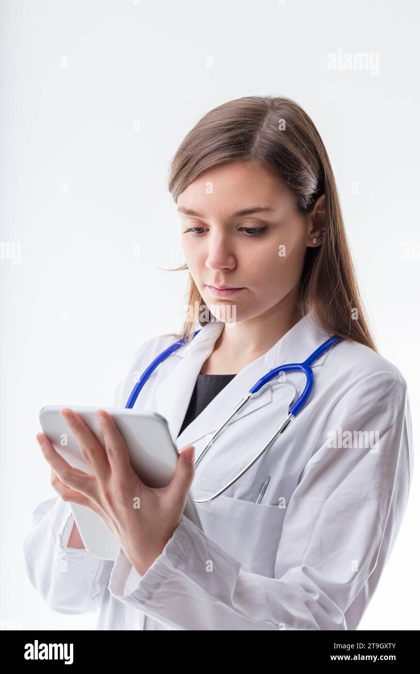Dedicated healthcare worker meticulously checks medical records on her ... Dedicated healthcare worker meticulously checks medical records on her ...