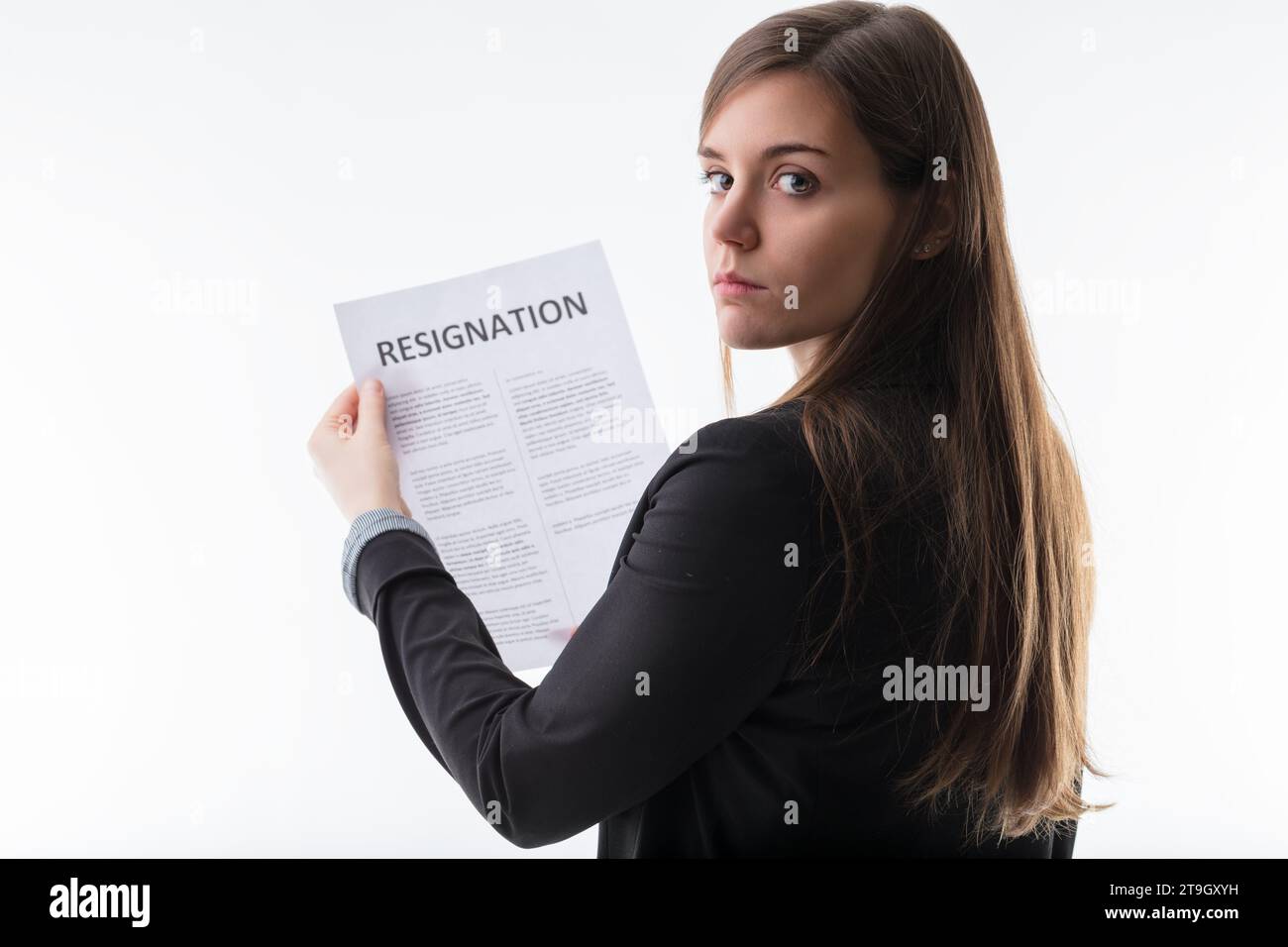 Serious expression on woman facing the implications of resignation ...