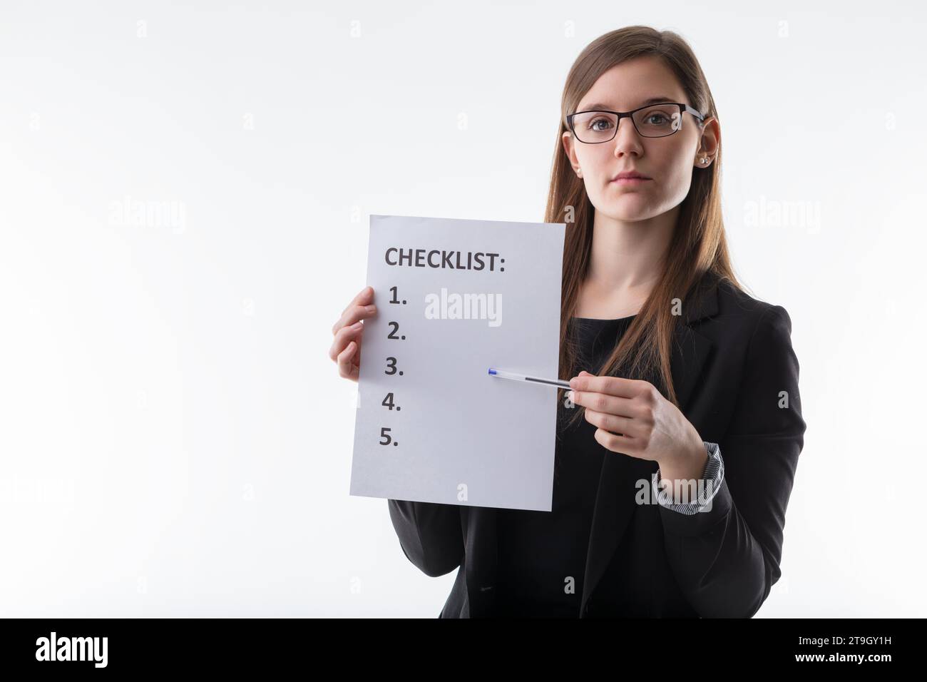professional woman presents a checklist, symbolizing organization ...