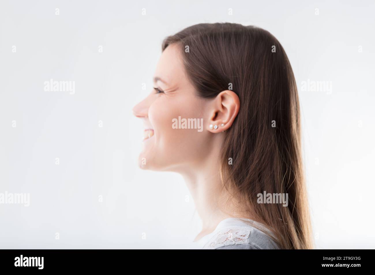 Woman's profile exudes cheer, her laughter echoing warmth and ...