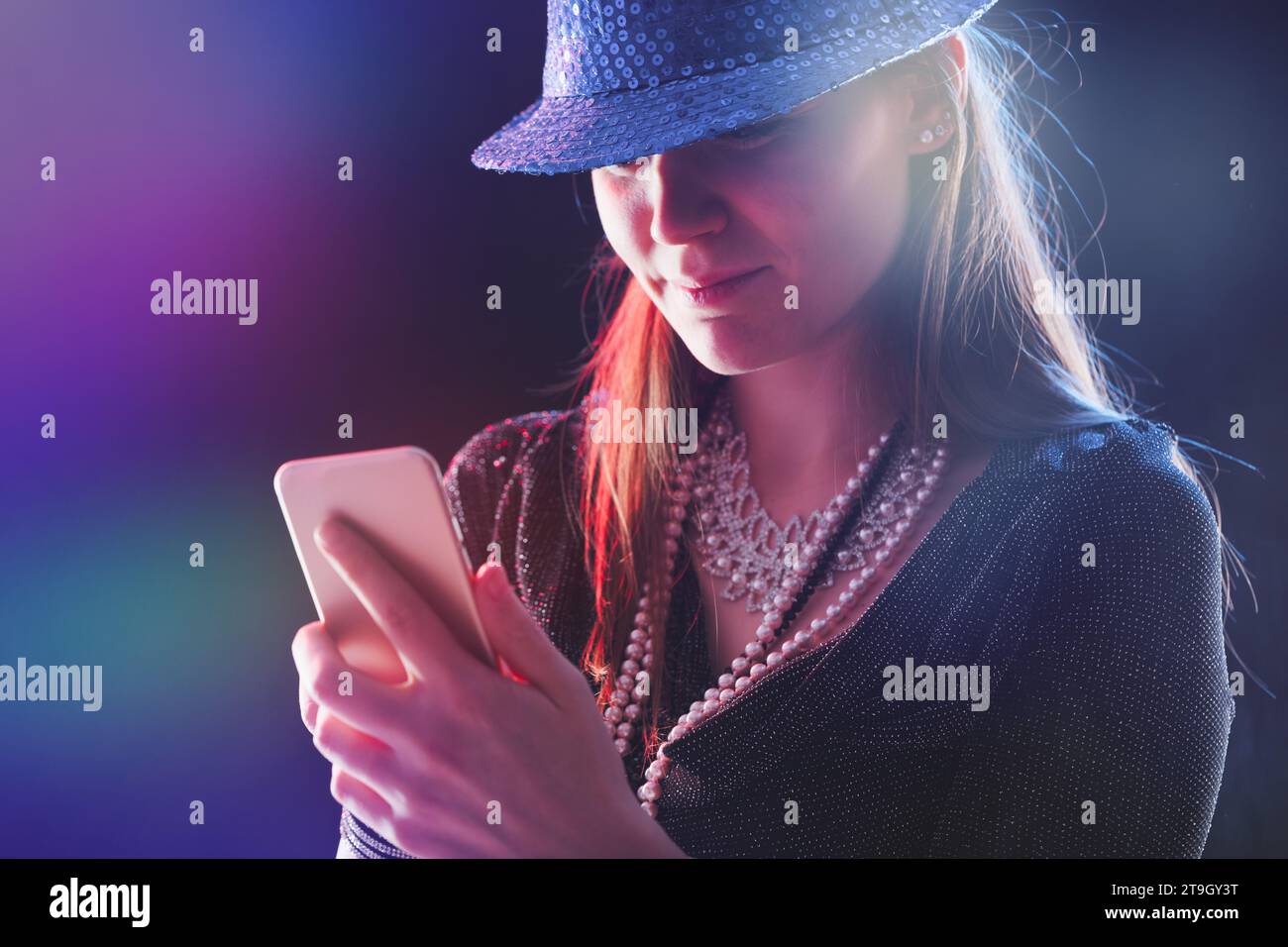 The vibrant hues of the background accentuate the woman's engrossment ...