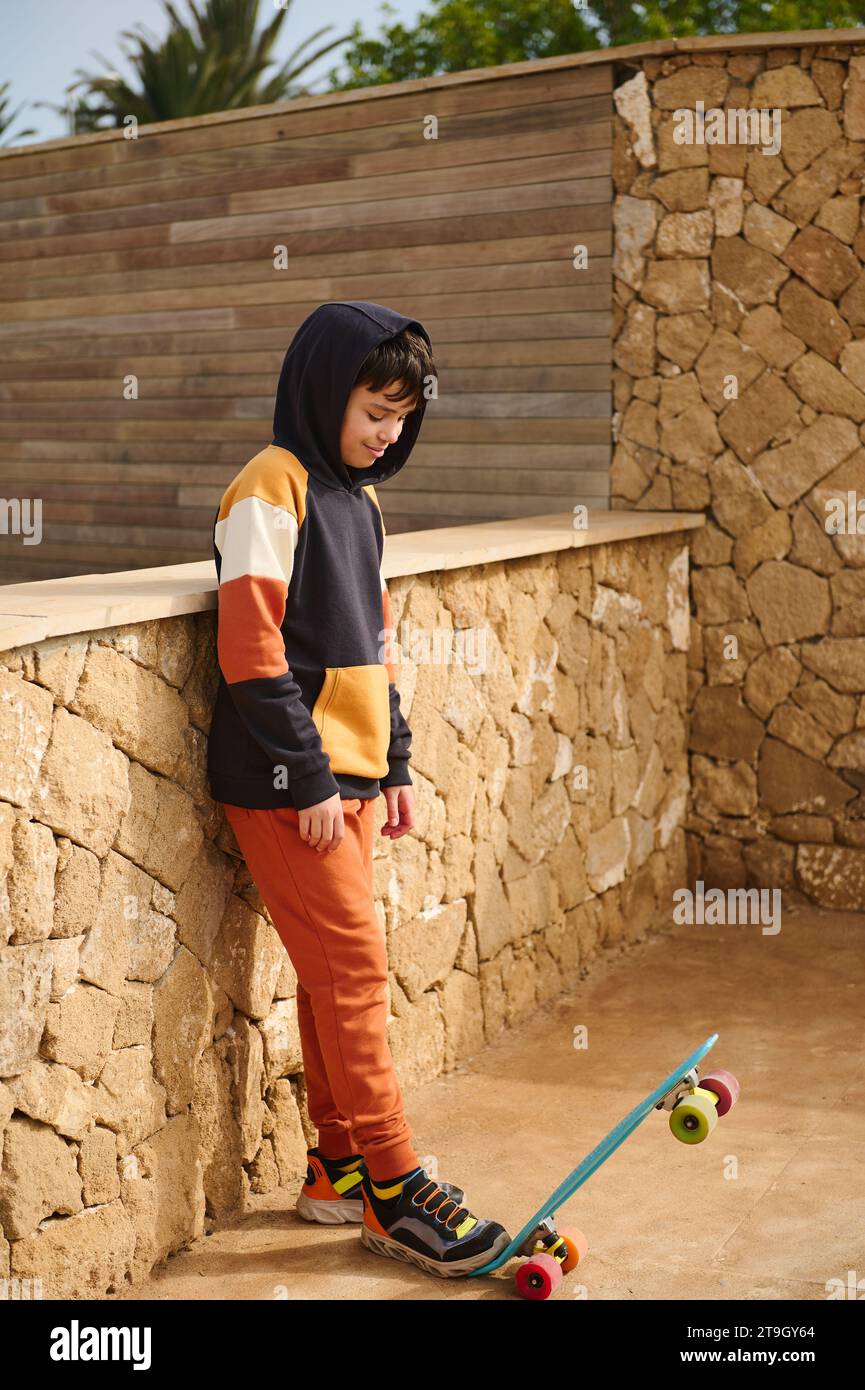 Full length portrait of happy child boy in stylish sports clothes ...