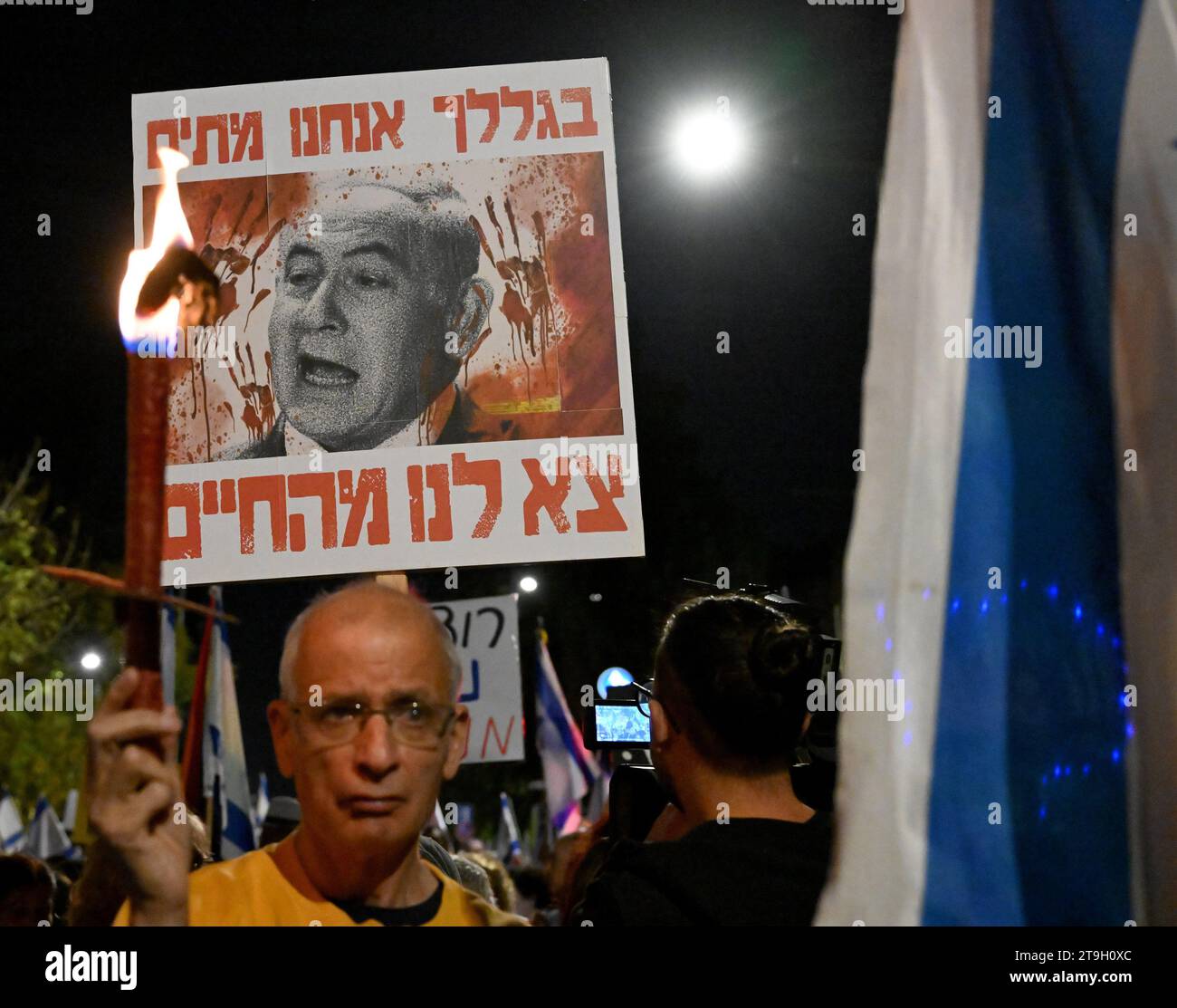 Jerusalem, Israel. 25th Nov, 2023. Israelis hold posters and chant ...