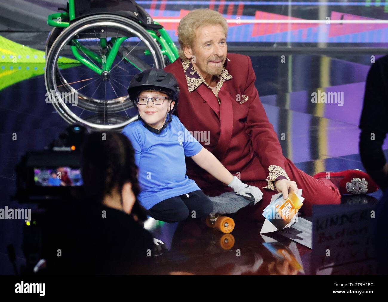 Offenburg, Germany. 25th Nov, 2023. Contestant Felix Mayr and presenter ...