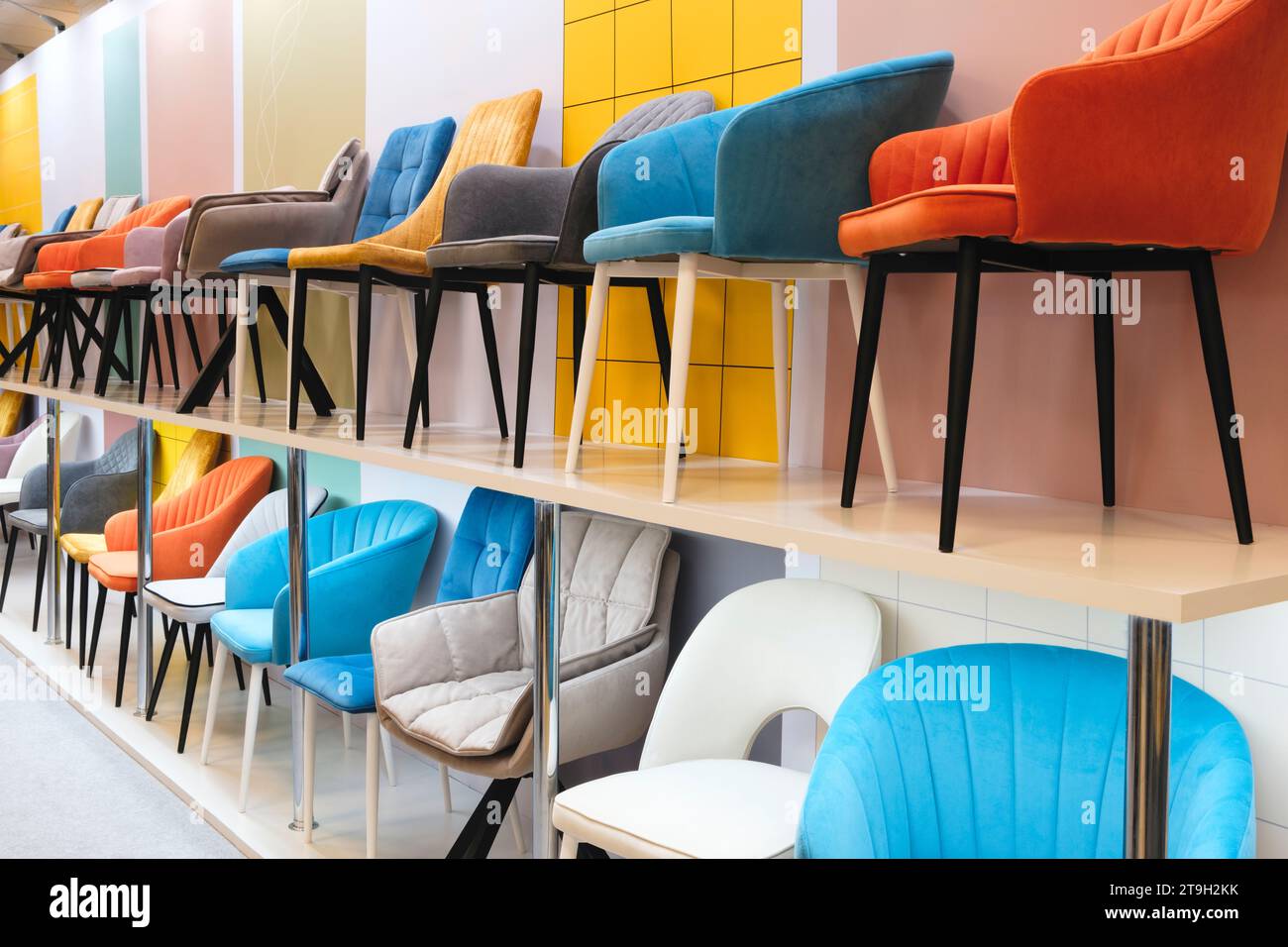Many different chairs and armchairs on display in a furniture store ...
