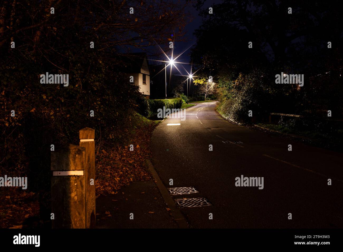 long exposure of quiet suburban road lit by street lamps in Exeter ...
