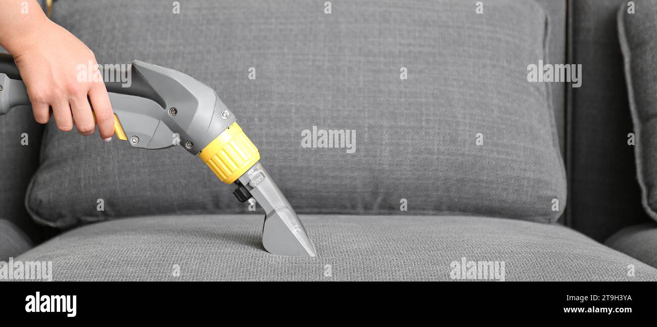 Dry cleaners employee hoovering hi-res stock photography and images - Alamy