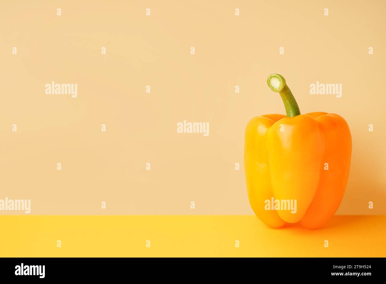 Fresh bell pepper on color table Stock Photo - Alamy