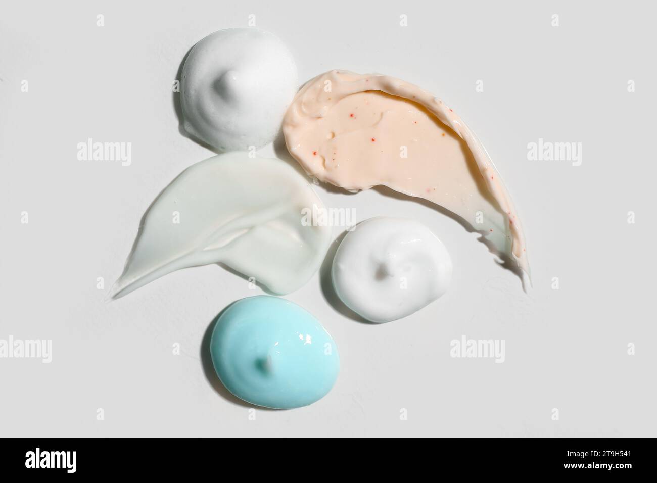 Samples of cosmetic products on grey background Stock Photo - Alamy