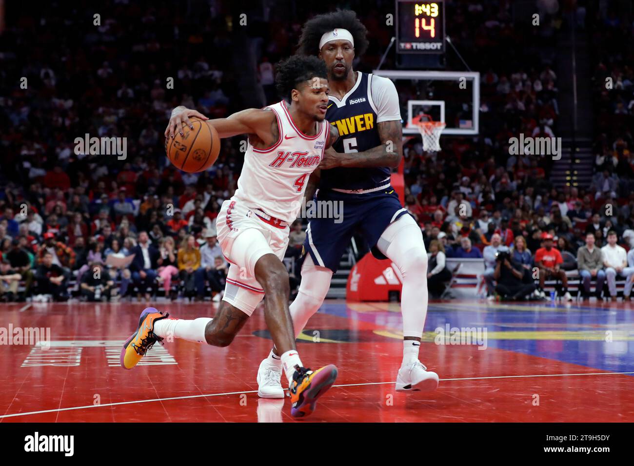 Houston Rockets guard Jalen Green (4) drives in front of Denver Nuggets ...